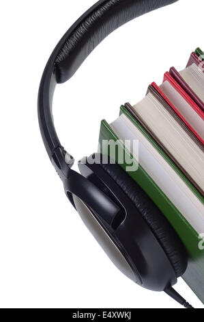 Headphones on books isolated on white representing audiobook concept ...