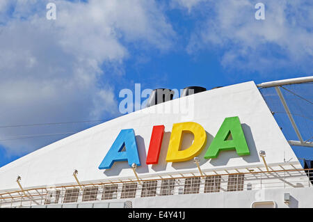 AIDA Logo at AIDA Bella cruise ship during cloudy day with boat deck in ...