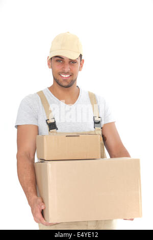 Handsome delivery man with parcels on light background with space for ...