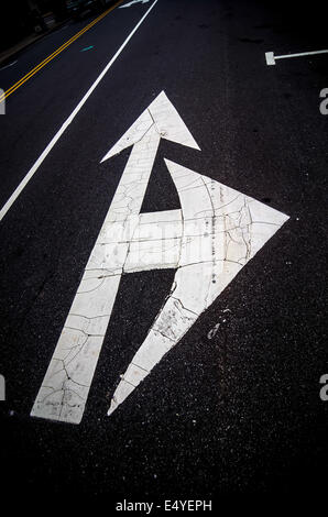 Painted pavement sign with up arrow and red circle around blank area ...