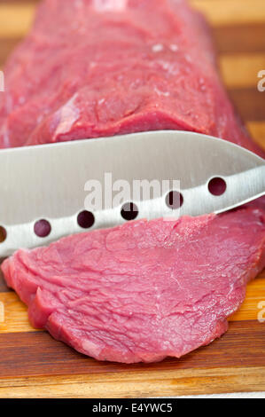 Image of raw a beef fillet cut into pieces Stock Photo - Alamy