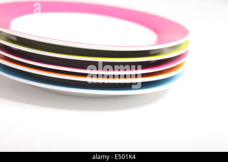 Culinary background : empty ceramic plates, wooden or bamboo spoons and ...