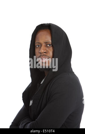 Portrait of unemotional African American male in trendy outfit standing ...