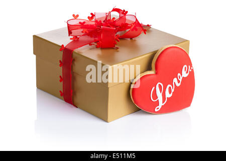 Valentines Day composition with red and golden hearts over golden ...