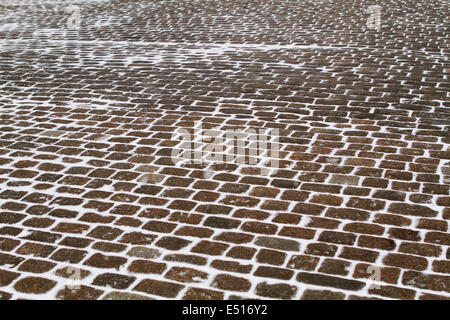 Closeup view on a cobblestone road pattern background contrasty due to ...