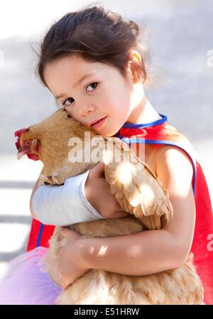Girl hugging chicken Stock Photo - Alamy