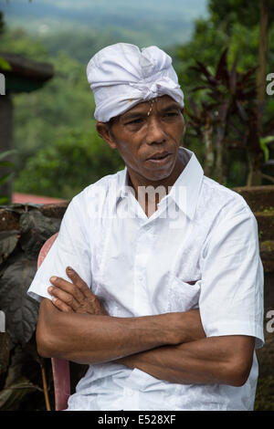 A Balinese man wearing traditional cloth Stock Photo - Alamy