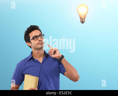 Young asian man getting an idea hand gesture Stock Photo - Alamy