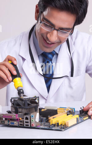 Young indian technician working on washing machine yawning tired ...