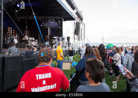A small crowd watching a band performing at the 'Sound of Music ...