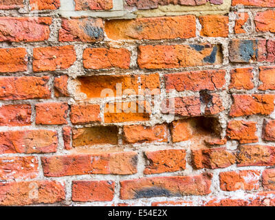 A frost damaged brick wall Stock Photo - Alamy