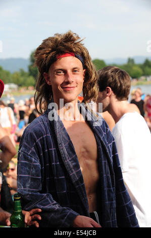 Freiburg, Germany. 19th July, 2014. Techno fans cool down on a hot ...