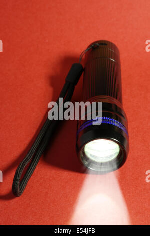 Black torch or flashlight with beam of light Stock Photo - Alamy