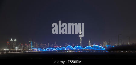 Modern architectural illuminated bridge at Meydan racecourse in Dubai ...