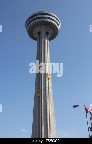 High concrete tower located in a tourist resort area of a big city ...