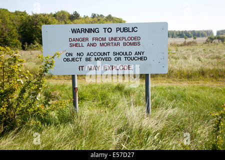 Warning notice sign Danger Unexploded ordnance on this beach it may ...
