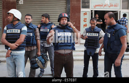 Al Jazeera Television newsroom with reporters and editors researching ...