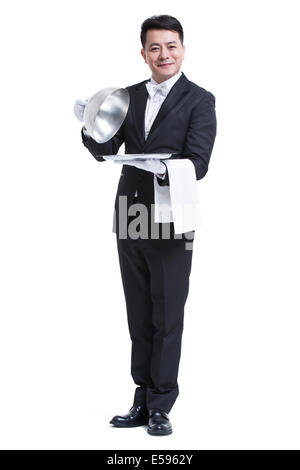 Waiter holding silver tray with food icons above Stock Photo - Alamy