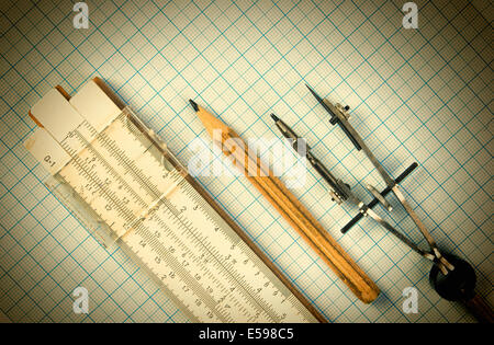 Old drawing tools on graph paper Stock Photo - Alamy
