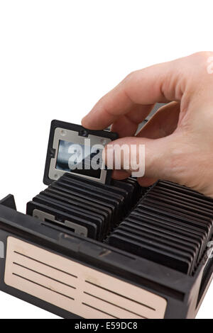 Old slides in a plastic box. Vintage 35mm slide film on wooden table ...