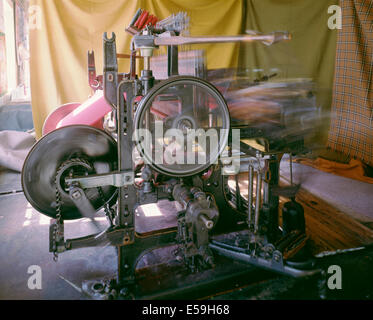 Cogs on old weaving machine in textile mill Stock Photo - Alamy