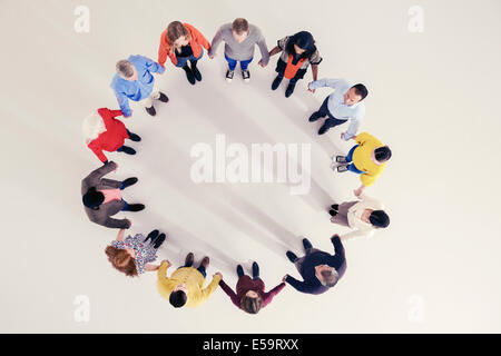 High angle of business people with hands together in a meeting Stock ...