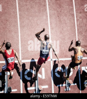 Sprinter taking off from starting block Stock Photo - Alamy