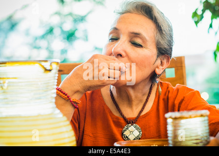 close up of woman eating at restaurant Stock Photo - Alamy