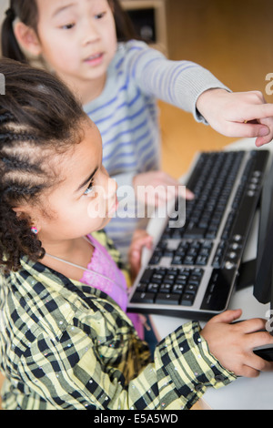Children using computer together Stock Photo - Alamy
