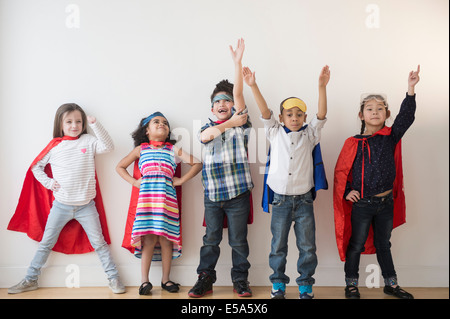 Group of children posing with raised hands isolated in white Stock ...