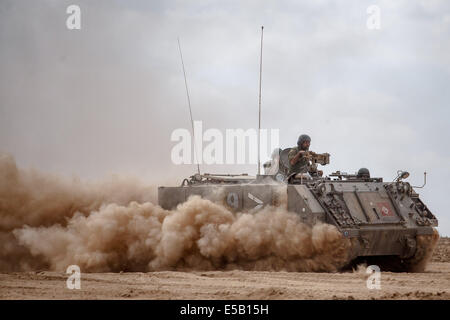 An Israeli armored personnel carrier (APC) moves along the Israeli-Gaza ...