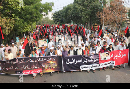 People burn U.S. and Israel flags during a rally in support of the ...