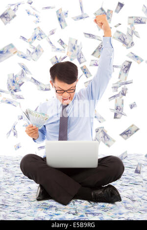 Young man watching stock market on laptop Stock Photo - Alamy