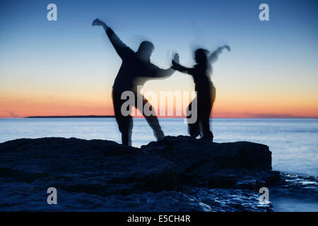 Shadows of two people fighting Stock Photo - Alamy