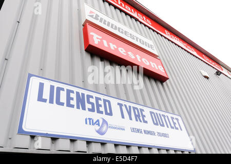 A logo sign outside of the Bridgestone Firestone agricultural tire ...