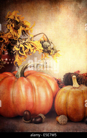 Close-up brown pumpkin with a bouquet of chrysanthemum on the table ...