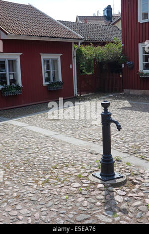 Public water tap in the middle of cobbled square of Old Lidköping ...