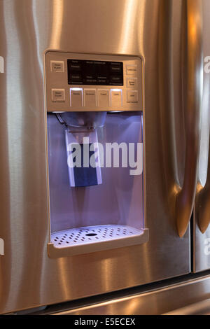 Refrigerator Ice and Water Dispenser modern close-up Stock Photo - Alamy
