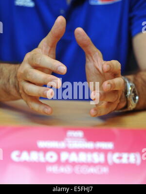 Women's volleyball team coach Carlo Parisi speaks at a press conference ...
