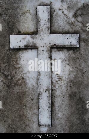 Old gravestone made of stone. Symbol of skull and crossbones is on the ...