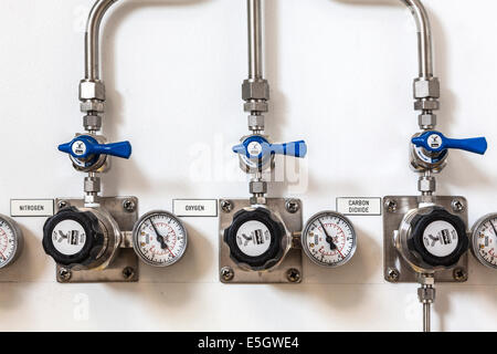 Gas supply taps valves for laboratory fume cupboard Stock Photo - Alamy