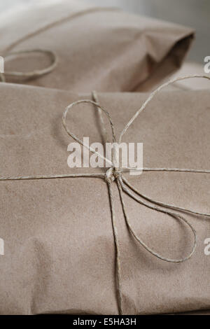 vintage style parcels wrapped with rope, on old oak table Stock Photo ...