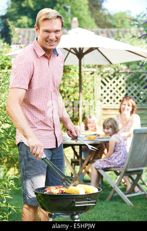 Mother and children cooking at home Stock Photo - Alamy