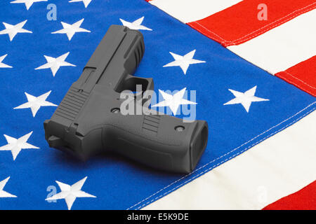 Handgun over USA flag - studio shoot Stock Photo - Alamy