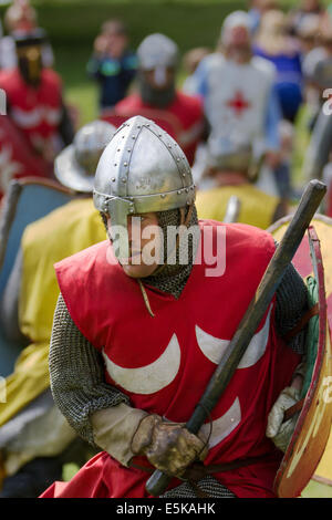 Medieval men playing the archery game of Popinjay, firing arrows at a ...