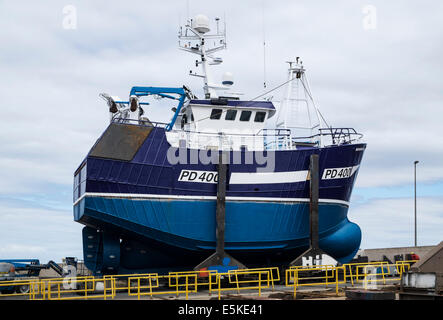 Fishing trawlers under repair at shipyard in Macduff in Aberdeenshire ...