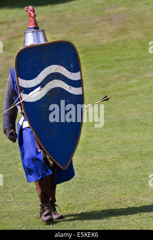 Uniform medieval archers and arrows in medieval recreation, celebration ...