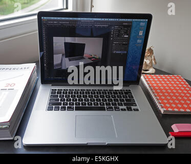 Apple Macbook Pro laptop computer front view with desktop on its ...