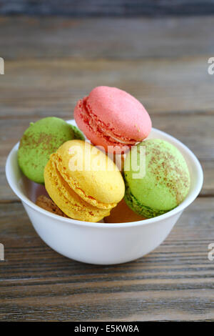 fresh Macaroons in French bowl isolated over white Stock Photo - Alamy