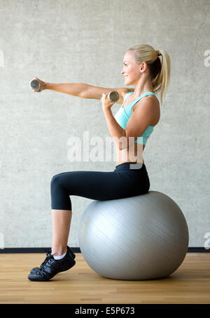 Stability And Balance Training. Smiling sporty woman doing abs ...